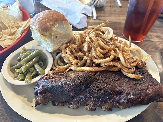 These ribs aren't falling off the bone &ndash; they're voluntarily leaping into your mouth, bringing along crispy onion straws and green beans for the ride.