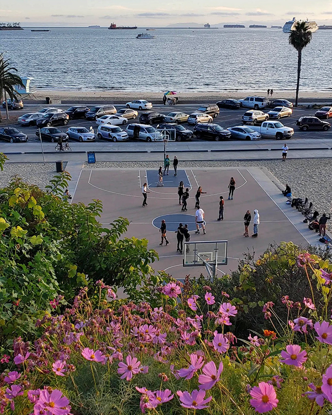 Beach basketball courts where the ocean breeze provides natural air conditioning and the backdrop beats any gym's painted walls.