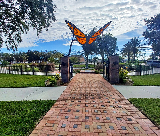 The Rotary Butterfly Garden welcomes visitors through a brick pathway beneath a magnificent monarch. Nature's art installation requires no admission fee.