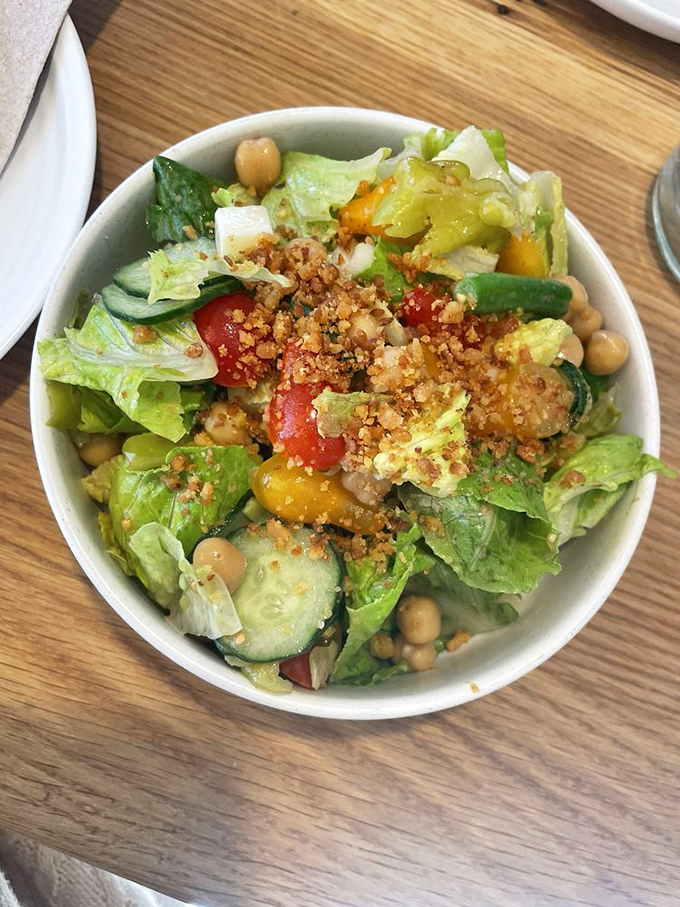This salad means business with its chickpeas and breadcrumb topping, offering redemption before or after pizza indulgence happens.