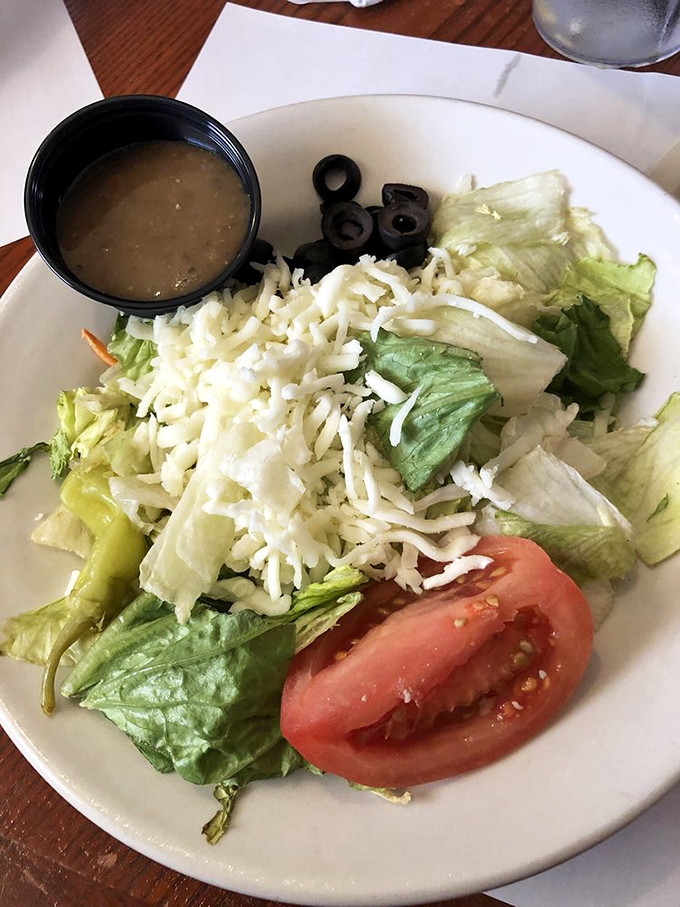 Even the salads here refuse to be boring, bringing fresh crunch to balance your wing adventure.