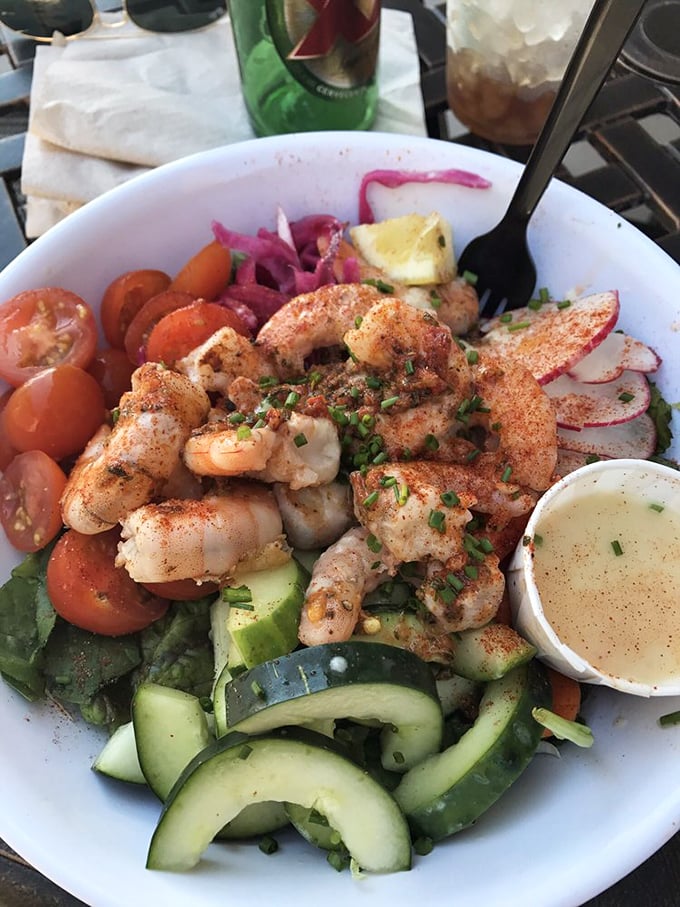 Who said healthy can't be heavenly? Plump shrimp crown this garden of earthly delights, proving salads can be both virtuous and indulgent.