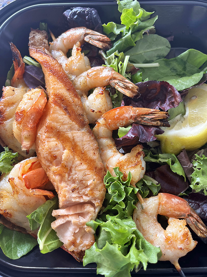 Grilled shrimp perched on fresh greens&mdash;proof that you can have your health food and enjoy it too.
