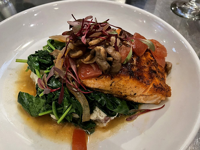Blackened salmon perched atop a bed of wilted greens&mdash;simple perfection that lets the quality of the fish take center stage.
