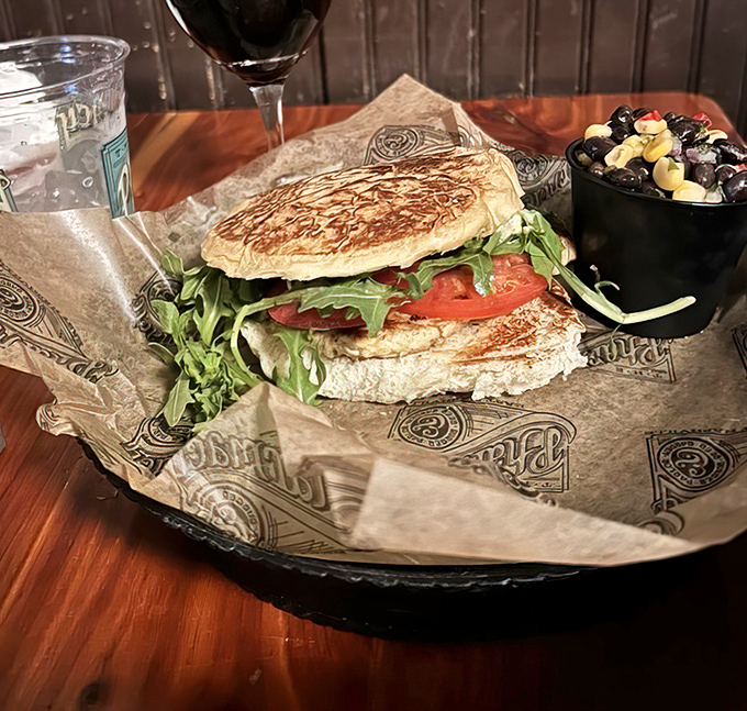 Fresh arugula and tomato brighten this sandwich like a pop of color in a perfectly designed room&mdash;as pleasing to the eyes as to the palate.