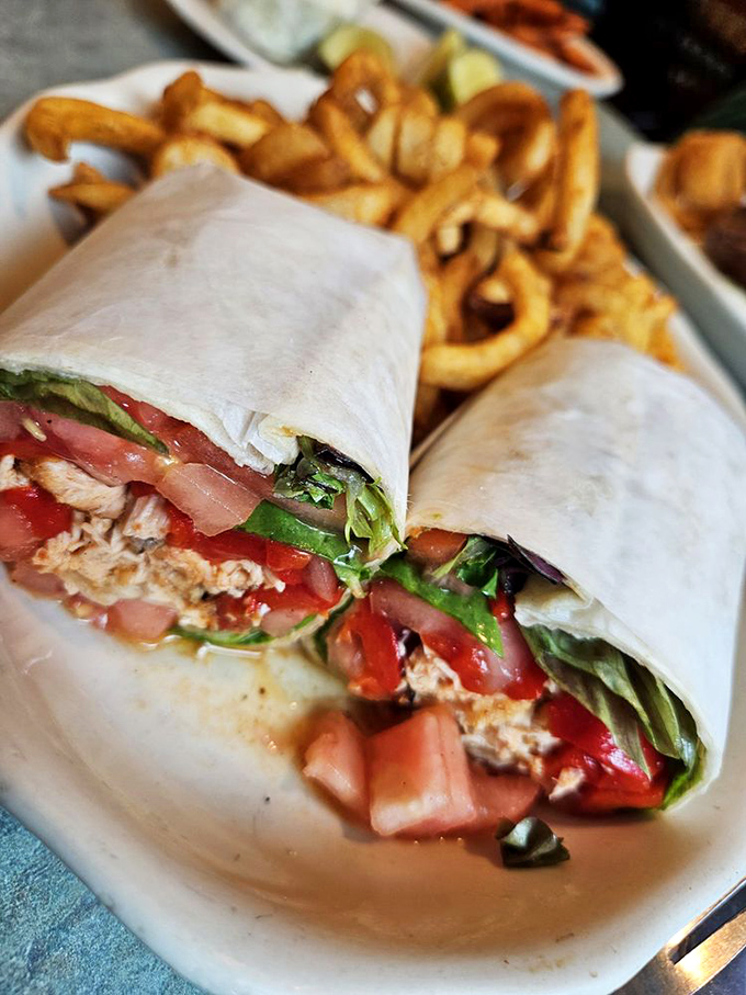 This wrap isn't just lunch—it's a portable feast with crispy fries that deserve their own fan club.