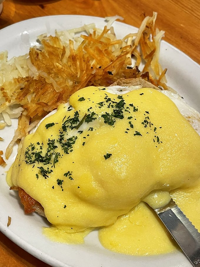 Salmon eggs Benedict drowning in hollandaise sauce, because sometimes you need elegance with your morning carbs and caffeine. 
