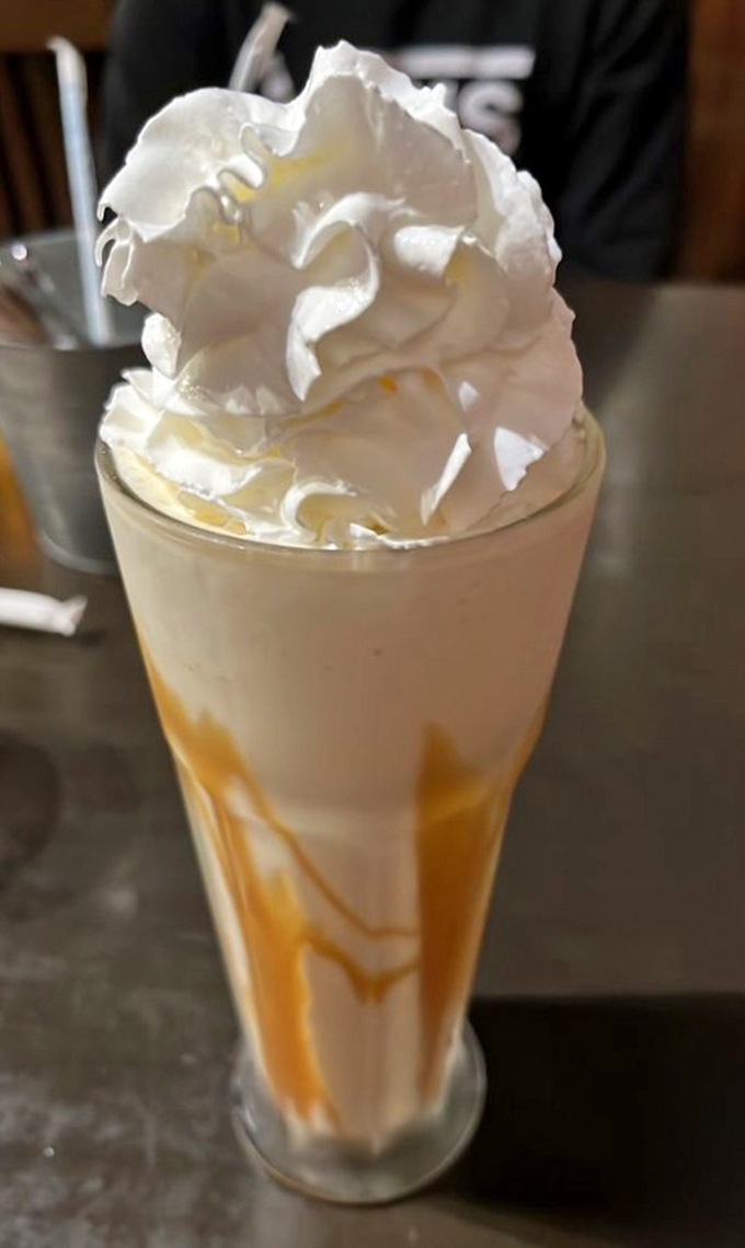 This salted caramel shake isn't just dessert&mdash;it's architecture. That whipped cream skyscraper deserves its own zip code.