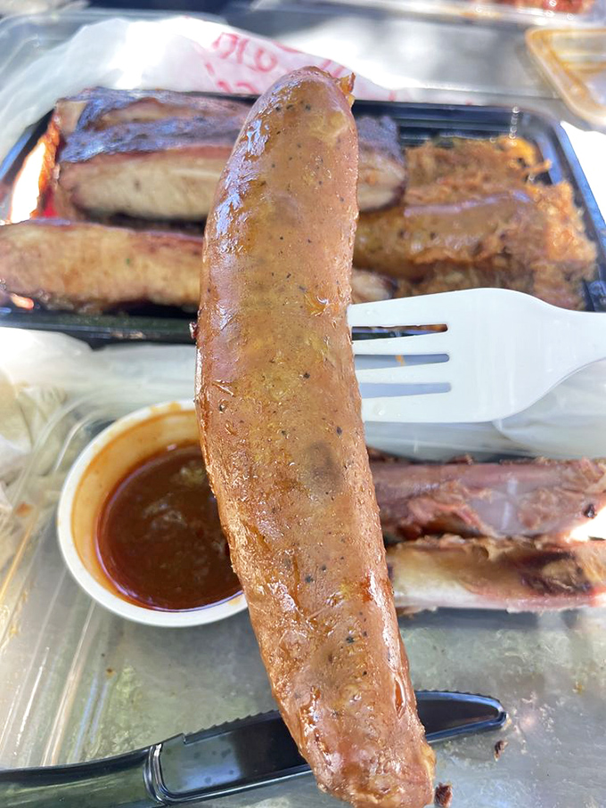 The sausage link stands at attention, glistening with promise. One bite and you'll understand why people drive hours for this.