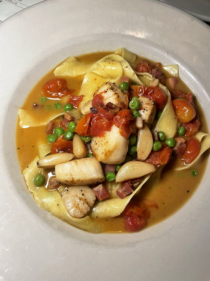 Scallops swimming with pasta, pancetta, peas, and beans in a sauce that makes you understand why people write poetry about food.