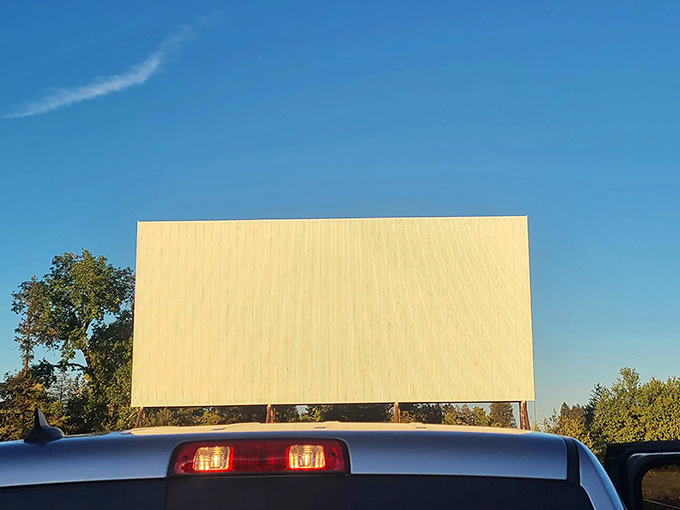 The view from the back seat &ndash; that quintessential drive-in perspective where your windshield frames cinematic adventures against a perfect blue sky.