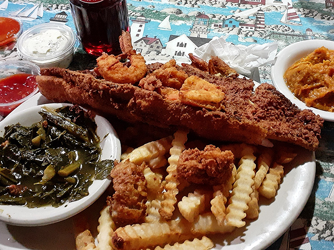 When your plate requires its own zip code! Collards, catfish, and crinkle-cut fries create the holy trinity of Lowcountry comfort.