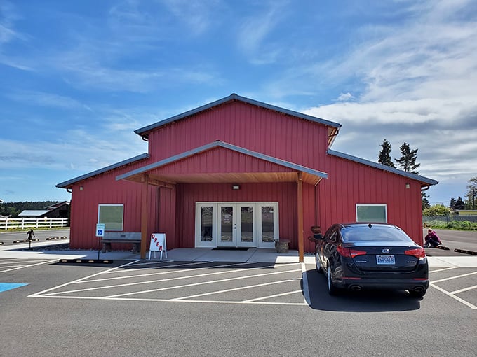 The red barn architecture says "working farm," but the parking lot says "come on in, city folks&mdash;we've got culture!"