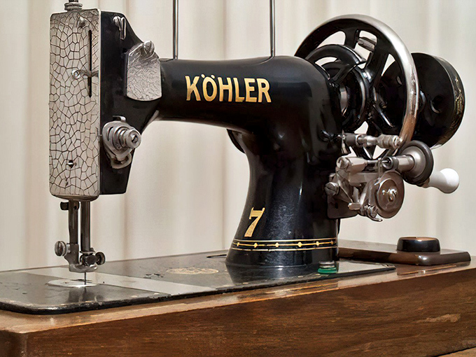 This vintage Kohler isn't just a sewing machine; it's great-grandma's superpower, ready to mend everything from torn jeans to broken hearts.