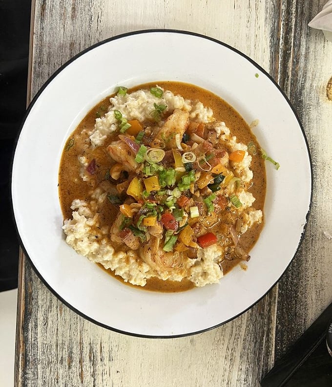 Shrimp and grits that look like someone's grandmother's recipe got a fancy culinary school education and came home better.