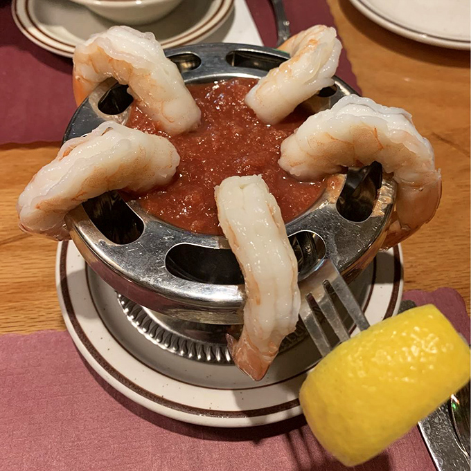 The classic shrimp cocktail&mdash;five plump sentinels standing guard around a pool of tangy sauce, a timeless appetizer that never goes out of style.