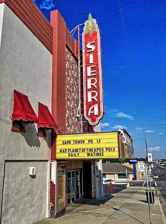 The Sierra Theater's vintage marquee glows like a beacon for anyone who misses when entertainment meant leaving the house.