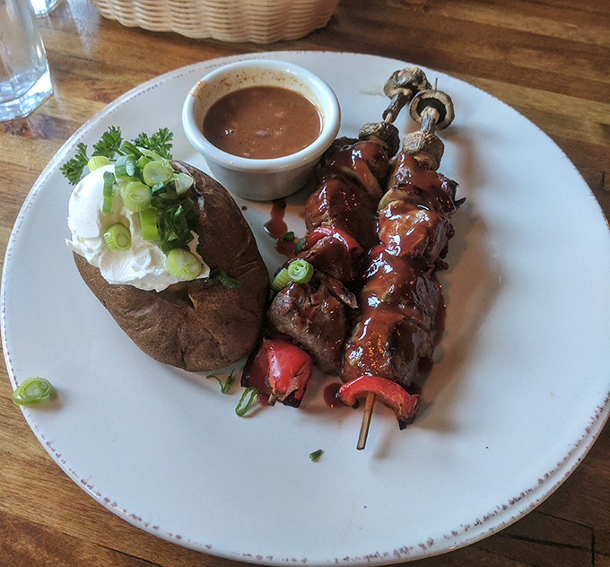 Meat on a stick might sound primitive, but these sirloin skewers are sophisticated enough to make cavemen weep with joy. The loaded baked potato isn't too shabby either.