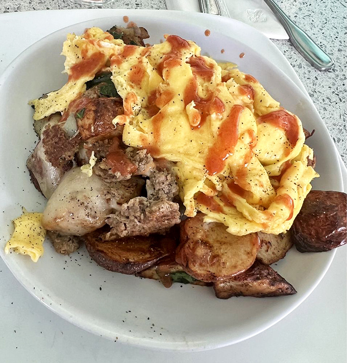 This skillet doesn't just contain breakfast&mdash;it's hosting a summit meeting where eggs, meat, and potatoes have gathered to solve world hunger, starting with yours.