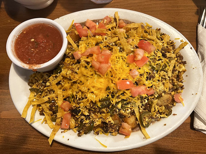 A skillet mountain of beef, cheese, and breakfast dreams that'll make you reconsider your definition of "portion control" forever.