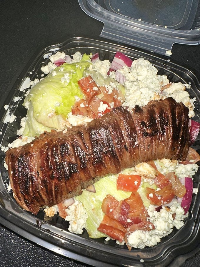 A Greek salad topped with sliced steak that makes you wonder why you ever bothered with lesser lunch options.