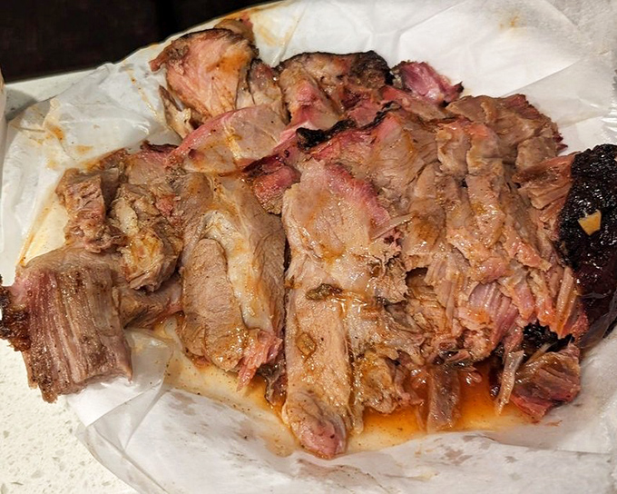 This chopped pork looks like it's been kissed by smoke for so long that it's practically surrendered to deliciousness.