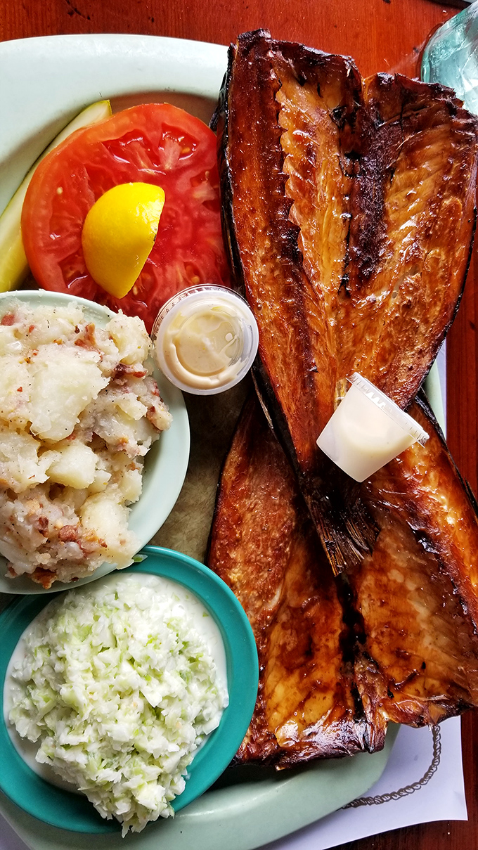 Smoked fish so perfectly bronzed it deserves its own category at the Florida tanning championships, served with sides that know their supporting role.