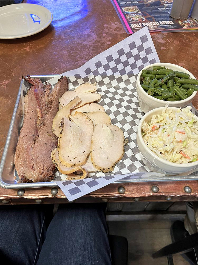 A meat plate that doubles as a color study in BBQ perfection, with sides that aren't afterthoughts but worthy companions to the smoky stars.