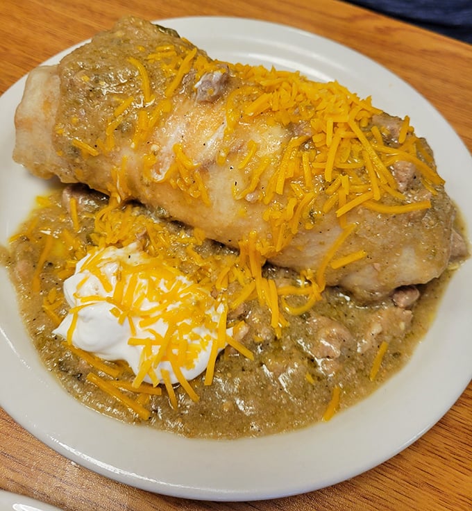 A smothered burrito that's essentially wearing a cheese sweater. This is the kind of breakfast that requires a nap afterward – and it's worth it.