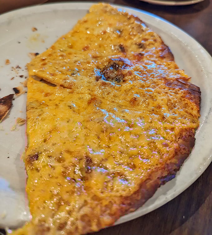 A cheese crisp that achieves the impossible&mdash;crispy edges, melty center, and the power to silence a table of hungry diners.