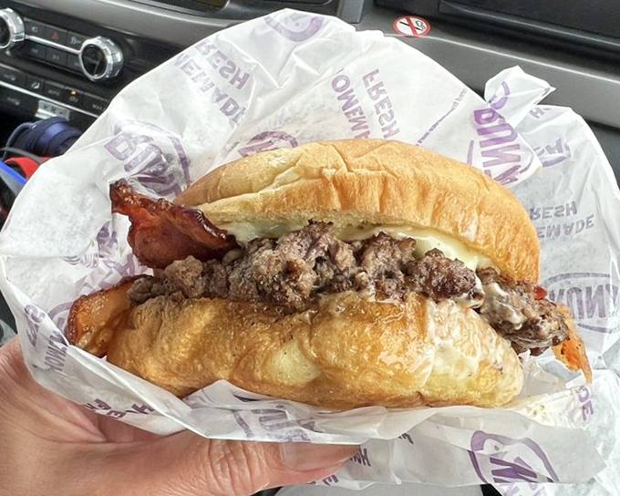 This isn't just a sandwich&mdash;it's a portable feast wrapped in paper, perfect for one-handed eating while driving across Nebraska.