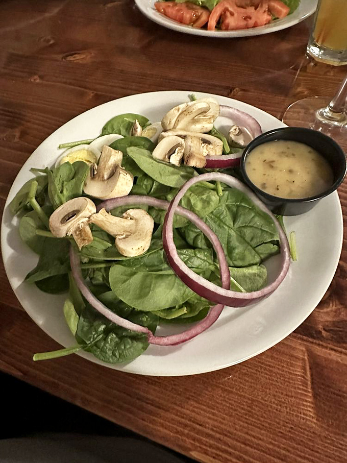 A spinach salad that doesn't feel like punishment. Fresh, vibrant, and proof that healthy eating doesn't have to be boring.
