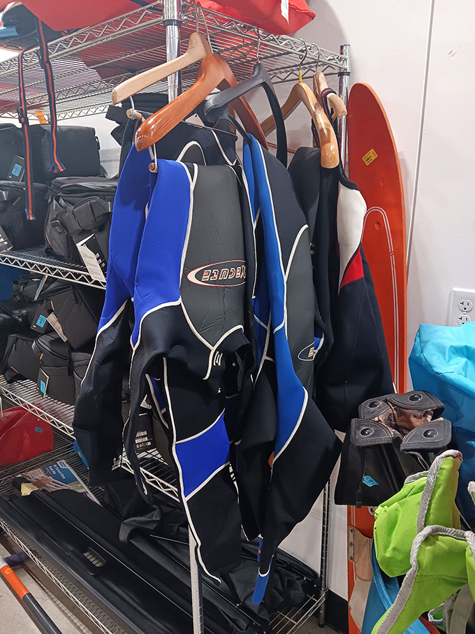 Wetsuits and sports gear hang ready for Oregon adventures, because trying new hobbies shouldn't require a second mortgage.