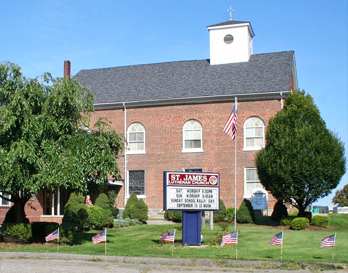 St. James Lutheran Church's brick fa&ccedil;ade and American flags represent the blend of faith and patriotism that runs deep in Phillipsburg.