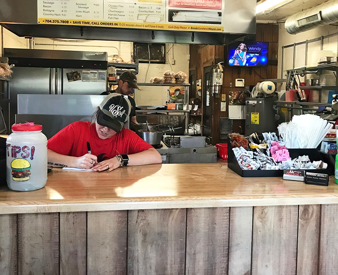 Where the magic happens. The open kitchen layout lets you witness burger artistry in real-time.