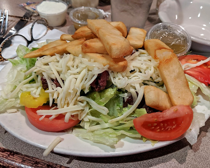 A steak salad that doesn't understand the concept of "diet food." Those golden fries standing at attention are Pennsylvania's salute to balanced eating.
