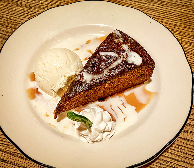 Sticky toffee pudding with ice cream: proof that the Scots understand dessert on a spiritual level. Sweet, rich, and utterly irresistible.