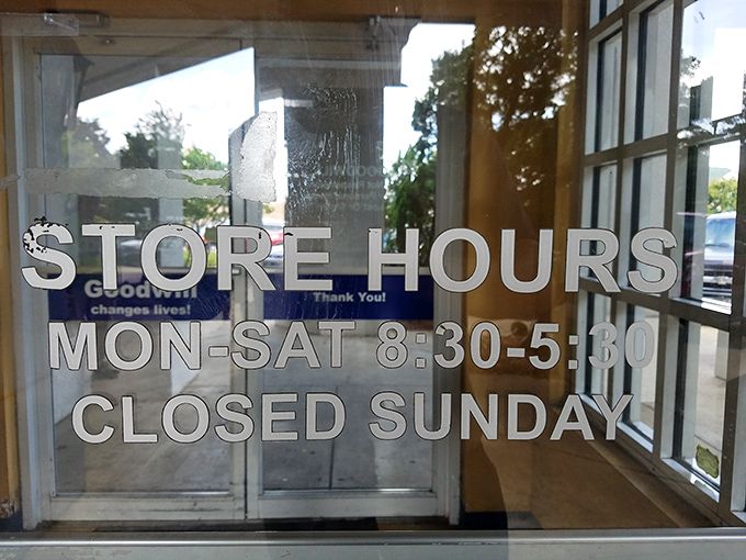 The store hours sign&mdash;a crucial piece of intelligence for planning your thrifting mission. Early birds catch the best merchandise before the weekend warriors arrive.