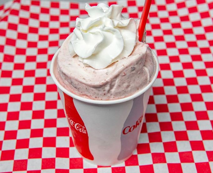 This strawberry shake isn't just pink&mdash;it's the color of optimism, topped with a cloud of whipped cream that dares you not to smile.