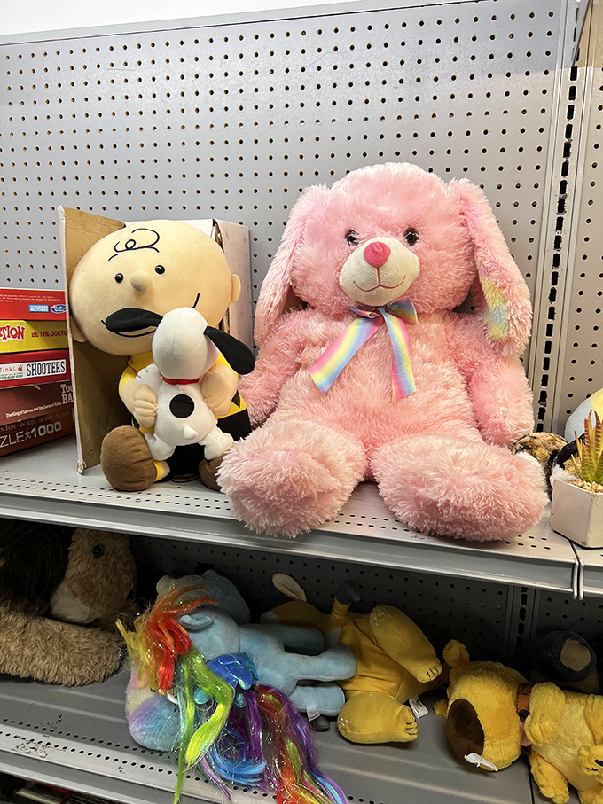 Stuffed animals patiently waiting for their forever homes. That pink bunny has seen things, but he's not telling.