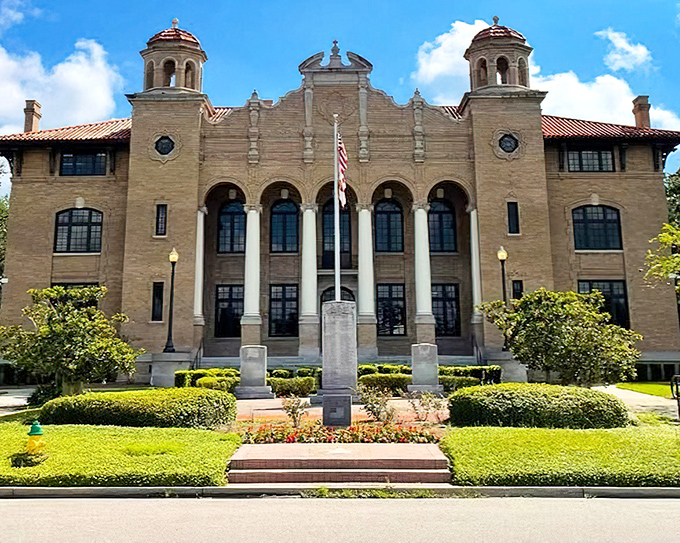 The Sumter County Courthouse gleams in Florida sunshine, its stately columns and meticulous landscaping offering a glimpse of civic pride that big cities often lack.