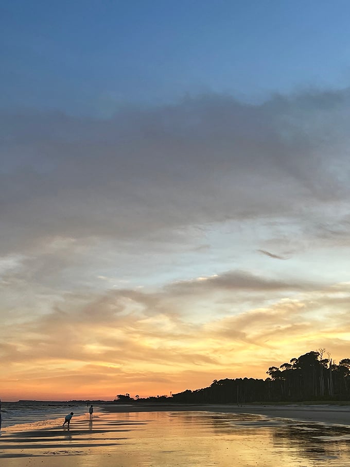 Mother Nature's nightly masterpiece paints the sky in watercolor hues, turning beach strollers into silhouetted poetry.