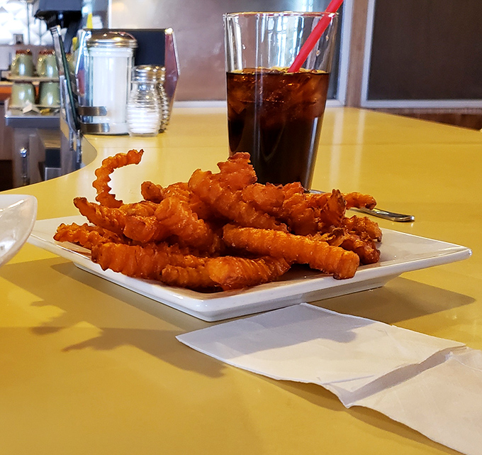 Curly fries with personality&mdash;twisted, golden, and crispy enough to make you forget your table manners entirely.