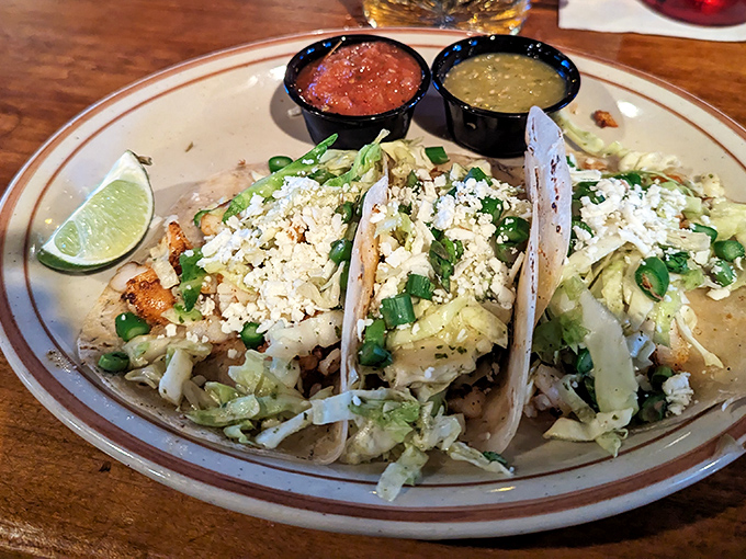Street tacos dressed to impress with fresh cilantro and cheese, ready for their close-up.
