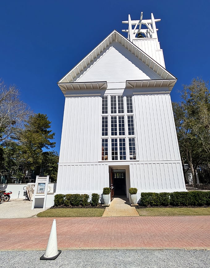 The Chapel's soaring white architecture and bell tower create a moment of serenity amid the beachy bustle of Seaside.