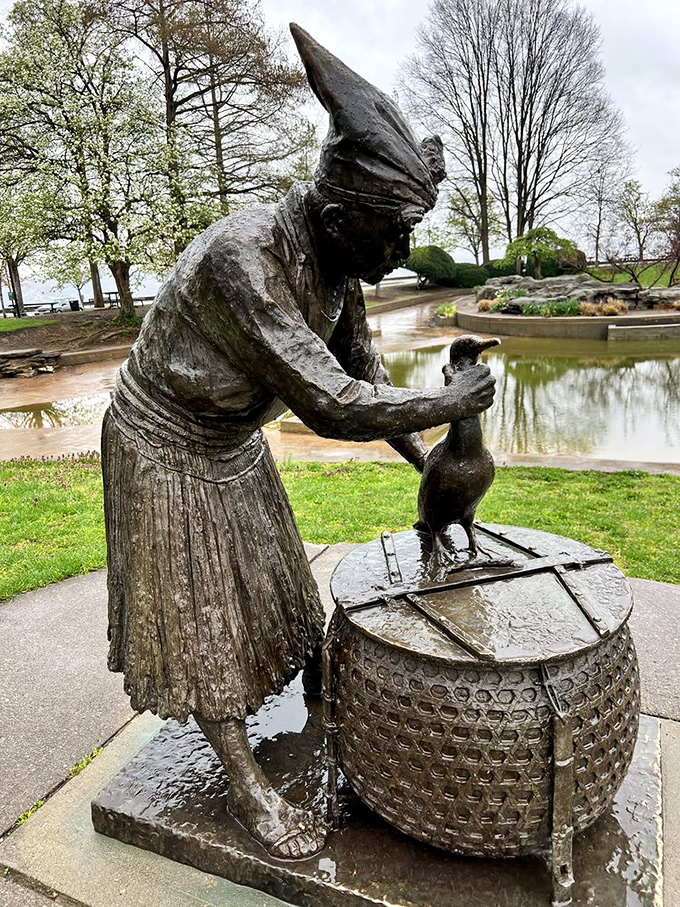 The Cormorant Fisherman statue tells stories of ancient traditions, frozen in bronze beside waters that reflect both sky and history.