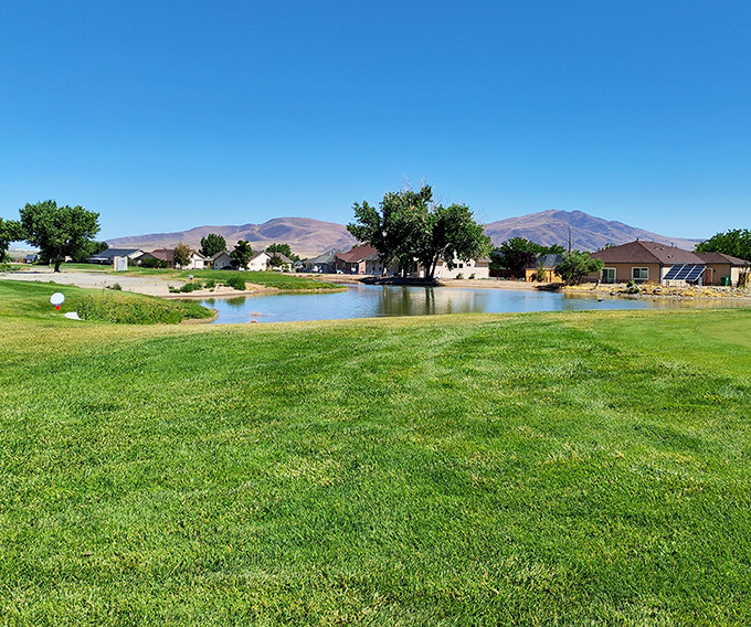 Golf course living with mountain views that never get old, where your biggest decision is which club to use, not which mortgage to refinance.