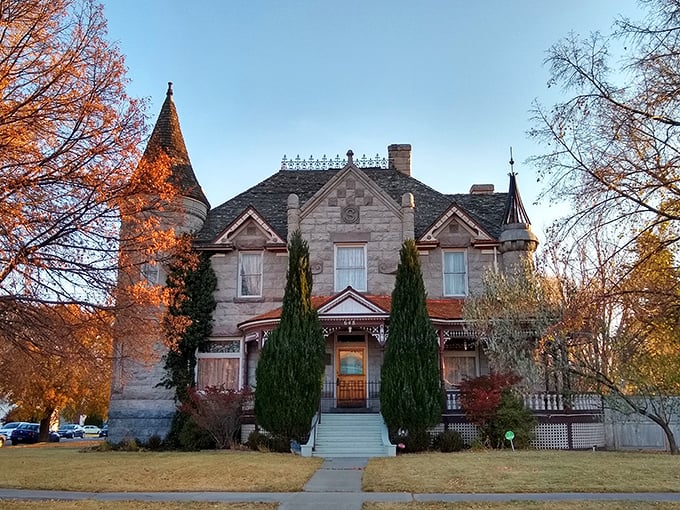 The Standrod Mansion glows with autumn splendor, its Victorian towers and turrets standing as elegant reminders of Pocatello's prosperous past.