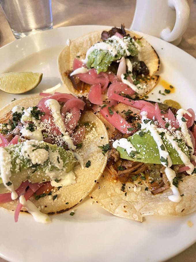 Tacos that don't just satisfy&mdash;they celebrate. Vibrant pickled onions and fresh avocado create a fiesta of flavors atop perfectly seasoned meat.