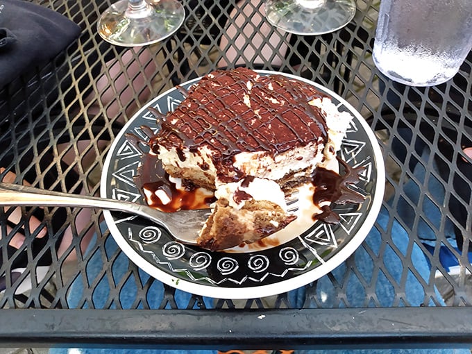 Tiramisu with layers visible like geological strata of deliciousness &ndash; coffee-soaked ladyfingers and mascarpone creating the dessert equivalent of a standing ovation.